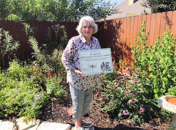 Volunteers tout pollinator garden assistance, recognition program ...
