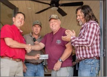 Archery club makes donation to FHS Building Trades group ...